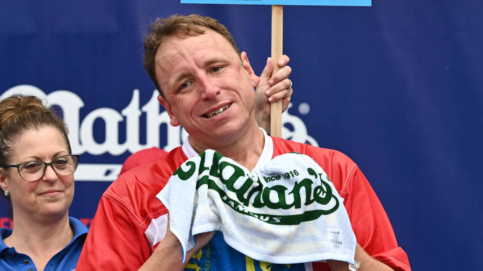 Joey Chestnut wins 16th hot dog eating contest after lightning delay ...