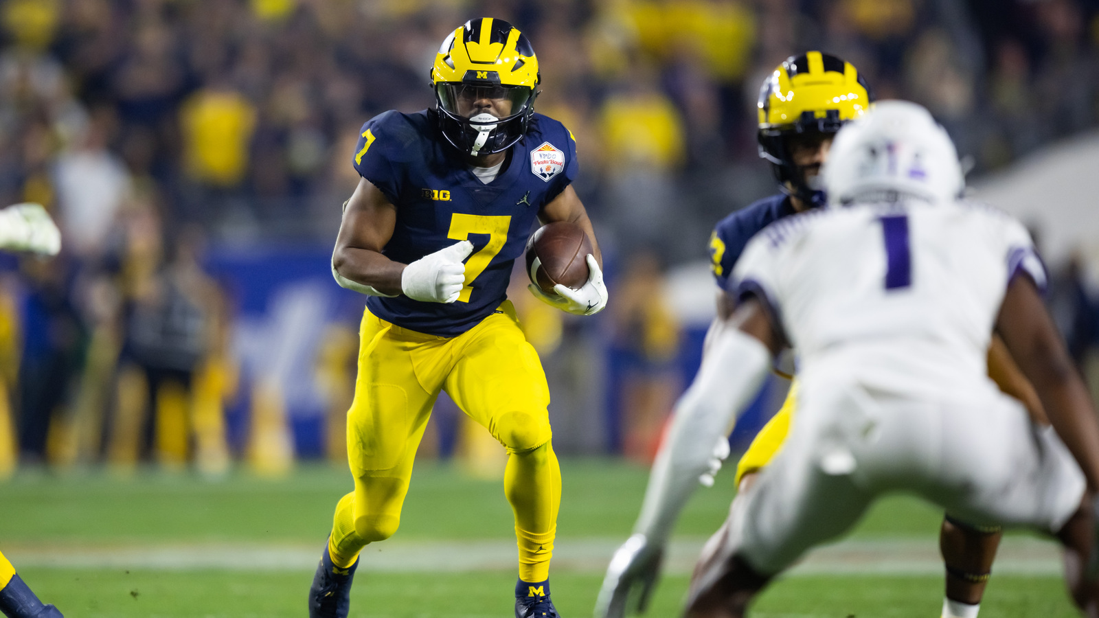 Michigan RB Donovan Edwards put up 991 yards and seven TDs with a ...