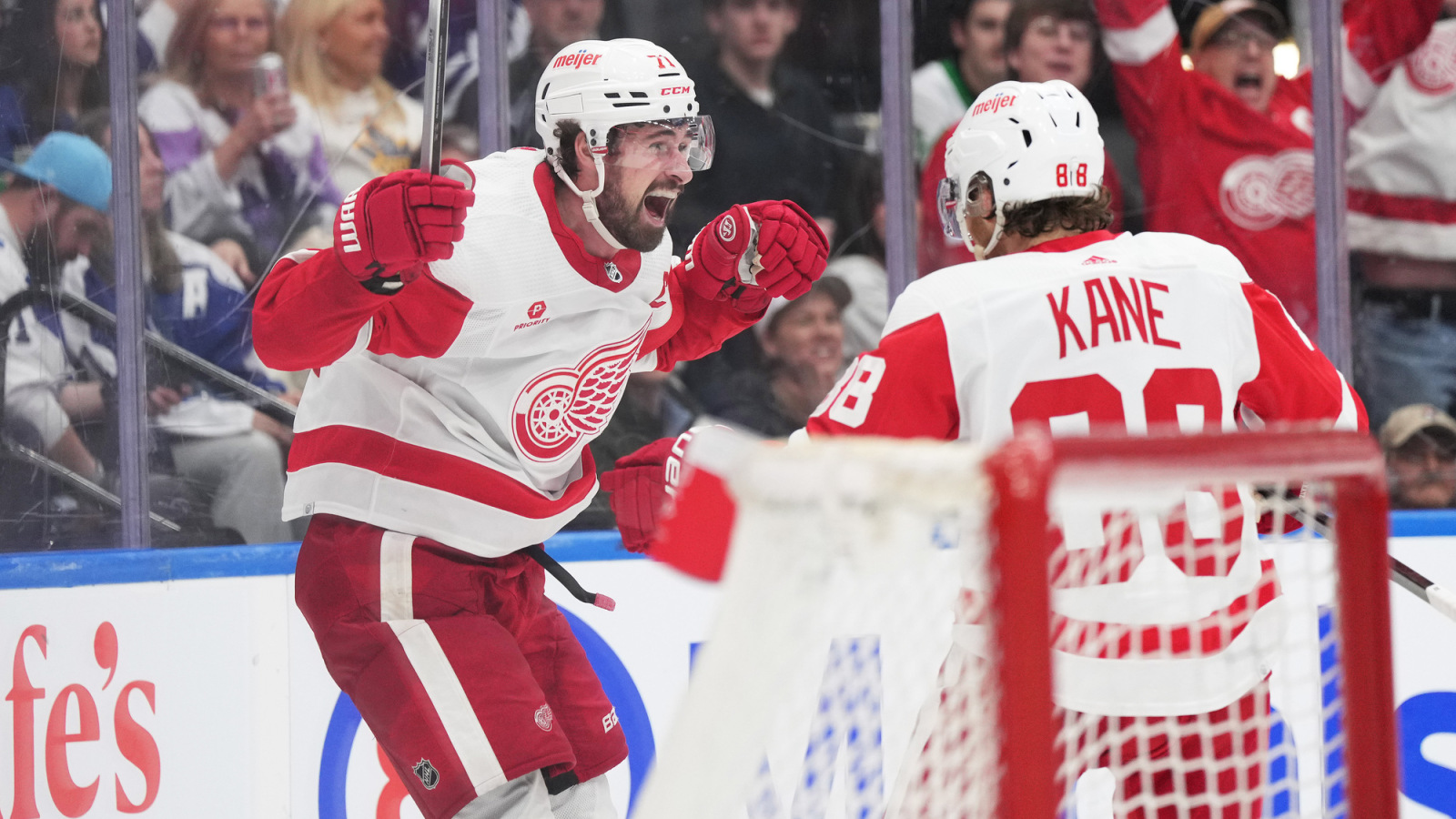 Dylan Larkin takes AJ Spellacy's head off with disgusting head hunt ...