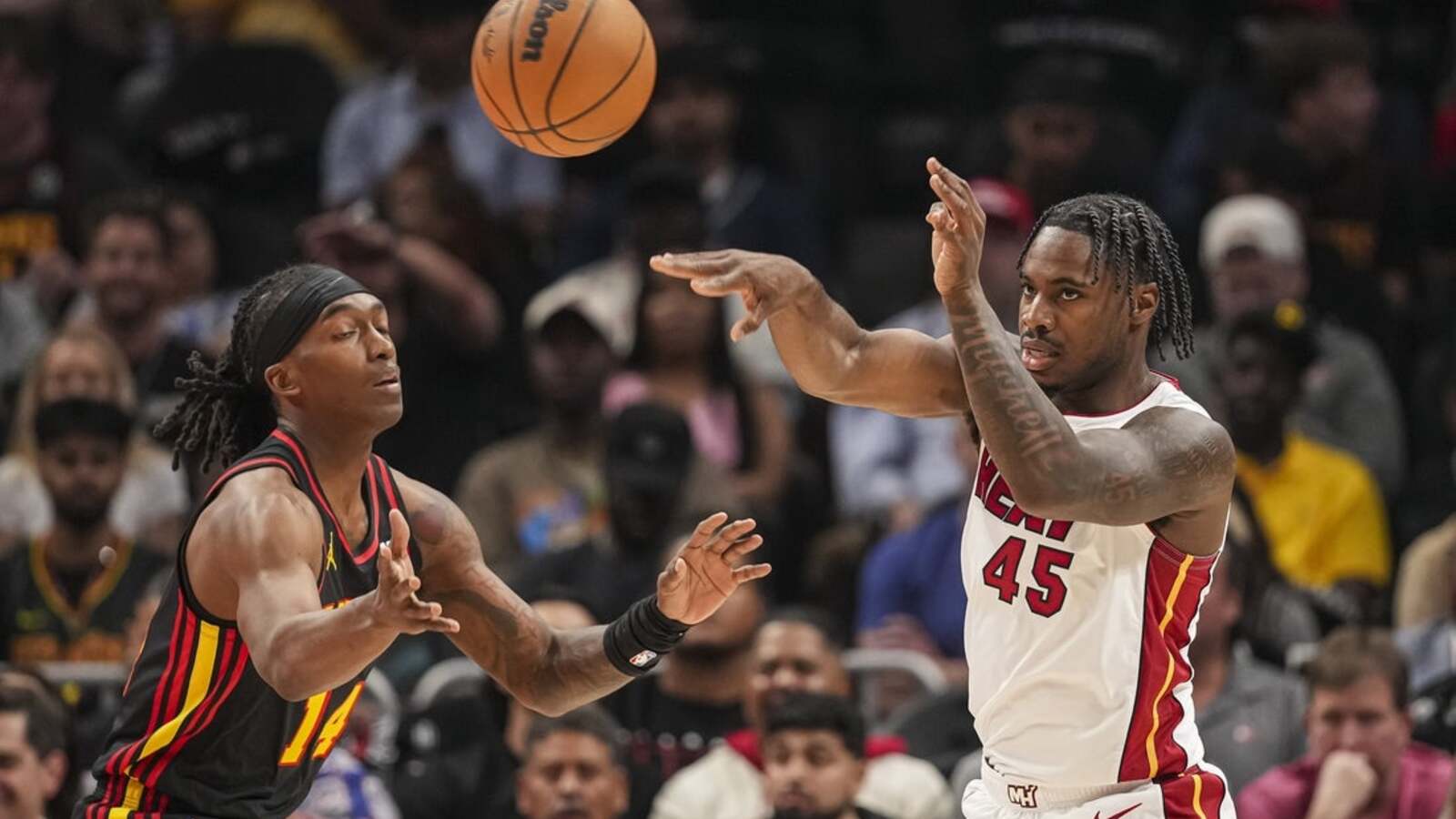 Heat pull away from Hawks in OT, secure 6th straight playoff berth ...