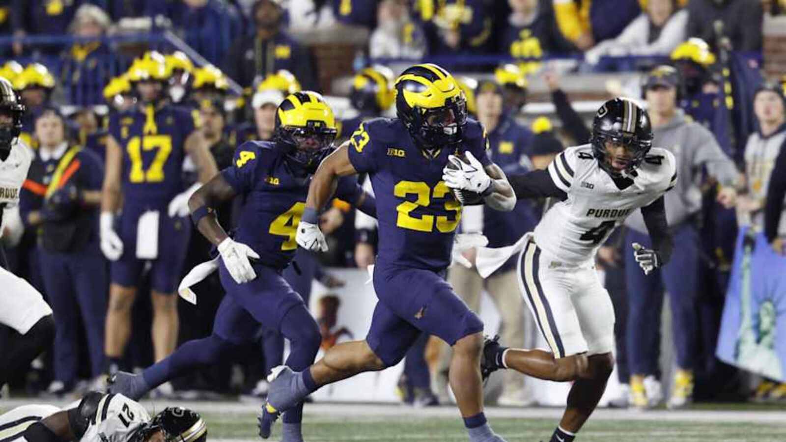 Handing out game balls in the Purdue vs. Michigan game | Yardbarker
