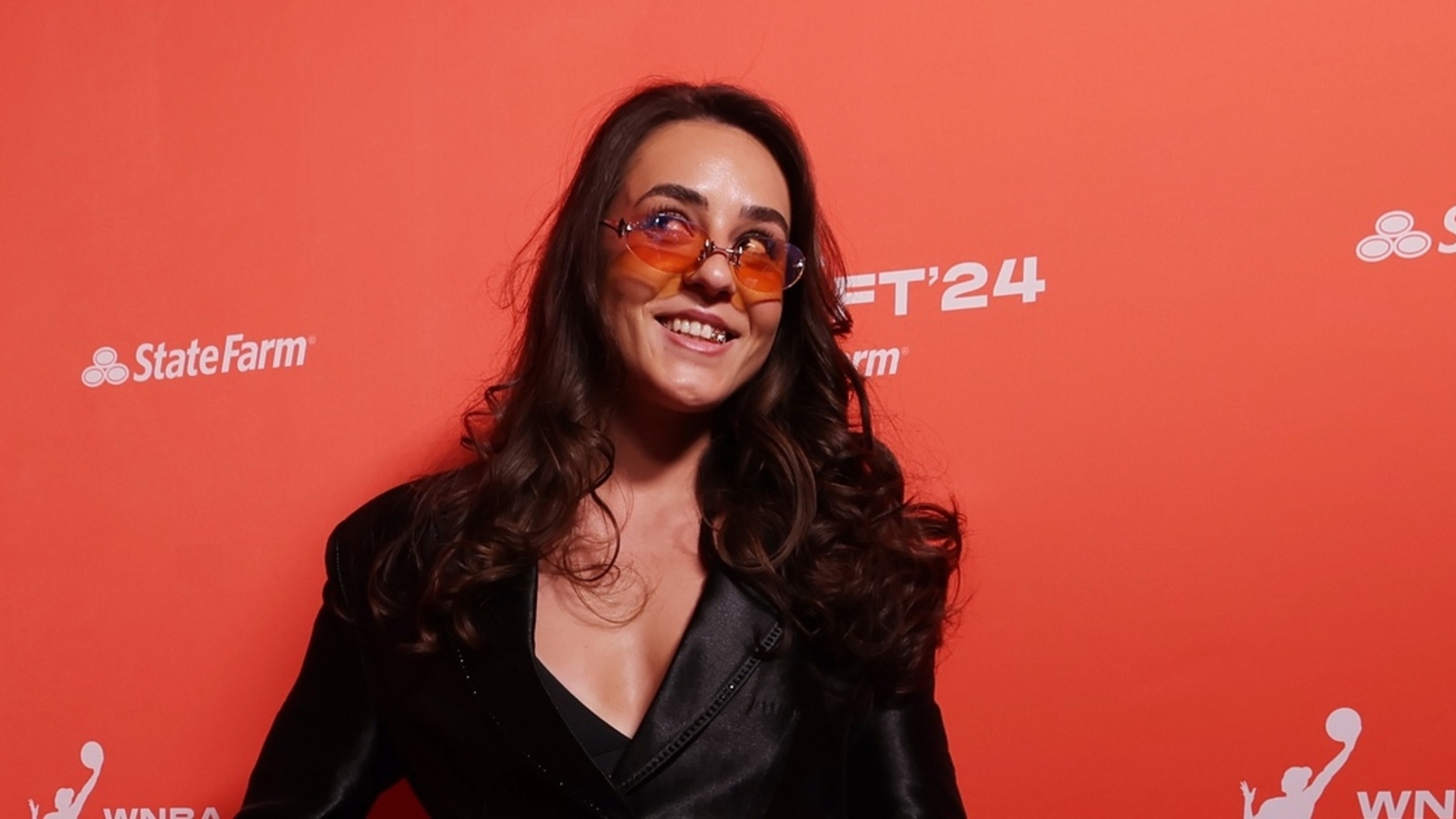 Nika Muhl shows off outfit at WNBA Draft orange carpet | Yardbarker