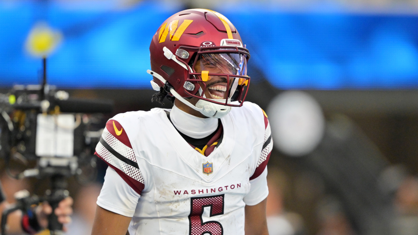 JuJu Watkins celebrates with Jayden Daniels after Washington Commanders ...