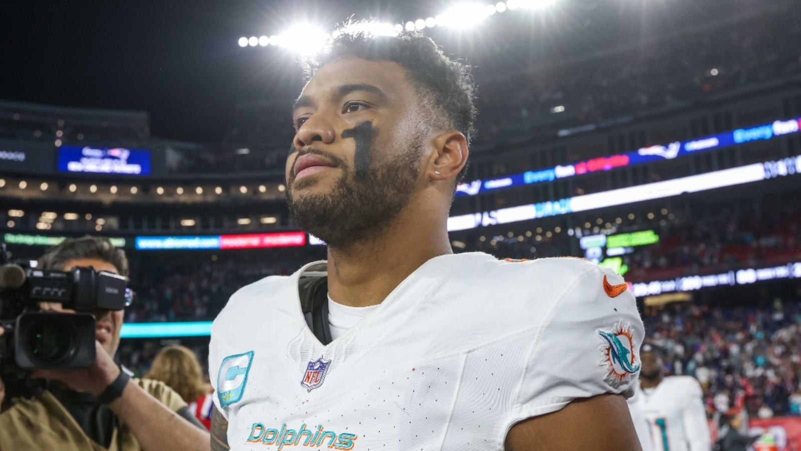 Tua Tagovailoa injury update: Dolphins QB surrounded by family in locker room after concussion ...